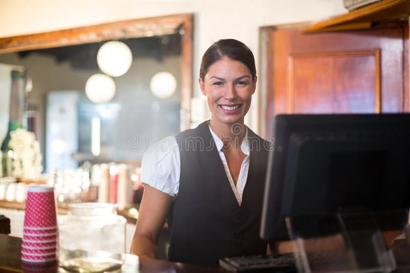 Waitress Working on Computer at Counter Stock Image - Image of adult ...