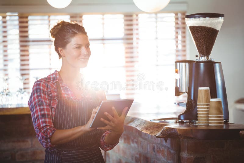 Waitress writing in a book stock image. Image of coffee - 73244505