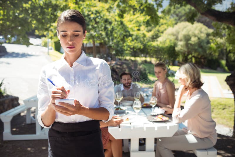 Waitress Writing Order on Notepad Stock Image - Image of assistance ...