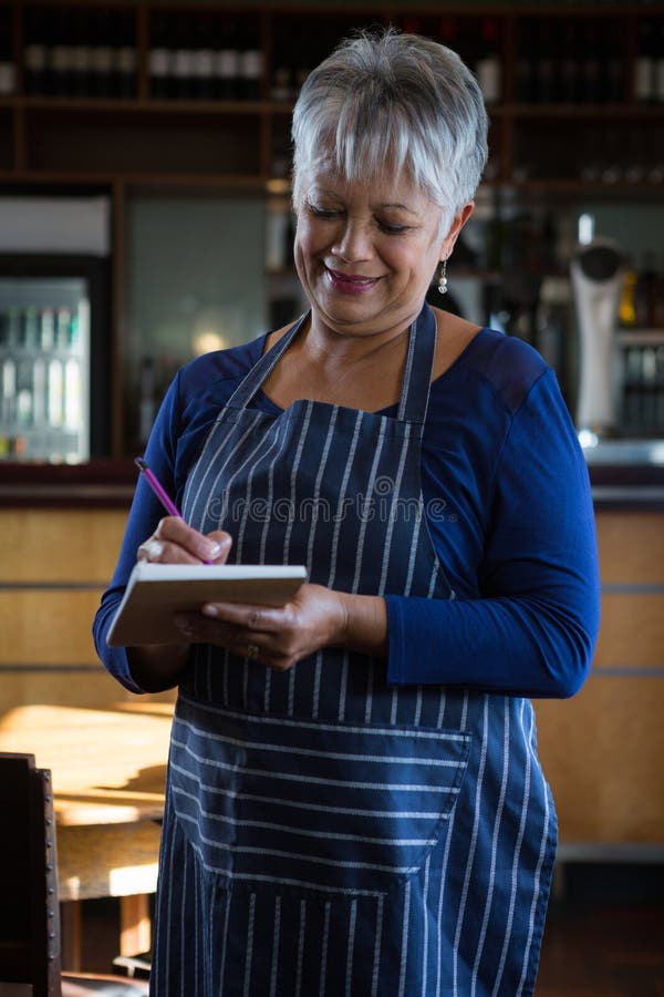 Waitress Writing an Order in the Notepad Stock Photo - Image of ...