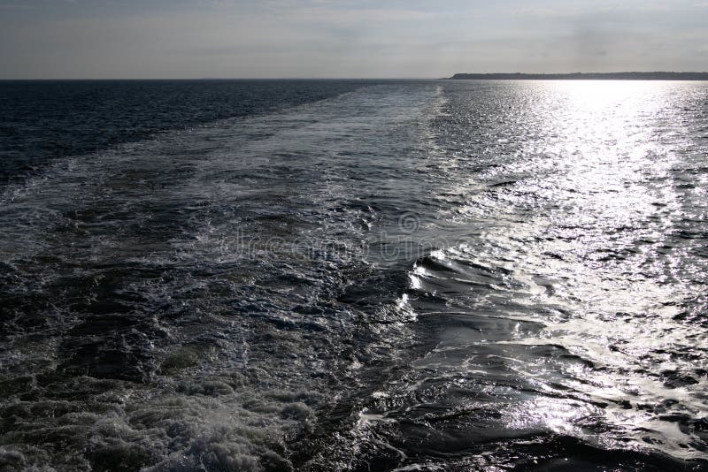 Wake Behind a Ship Reflecting the Sun Stock Photo - Image of ...