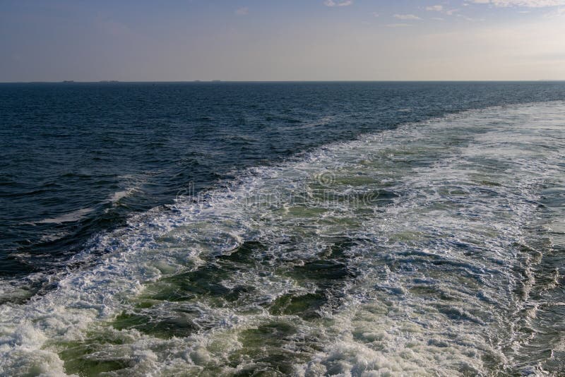 Wake Behind a Ship Reflecting the Sun Stock Photo - Image of ship ...