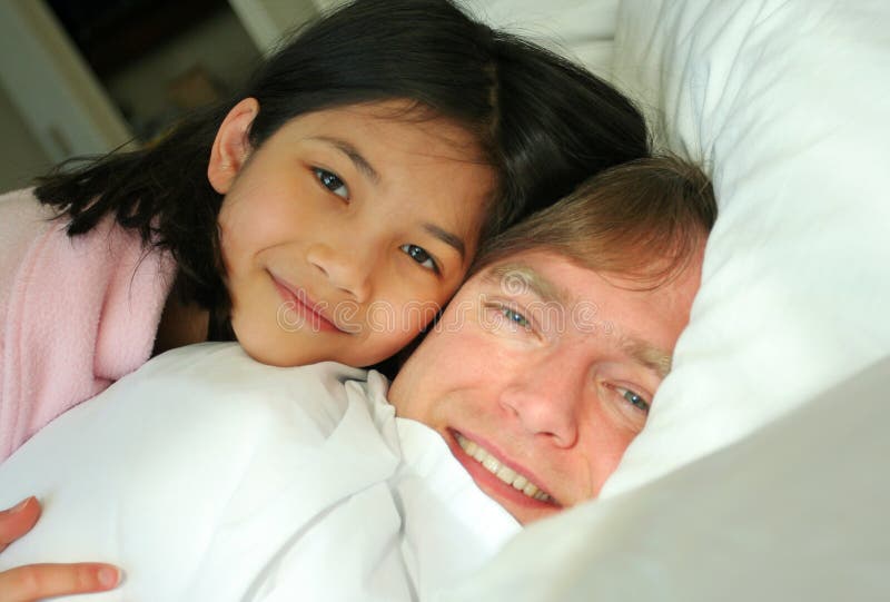 Wake up, Dad! stock photo. Image of multiracial, hugging - 4376790