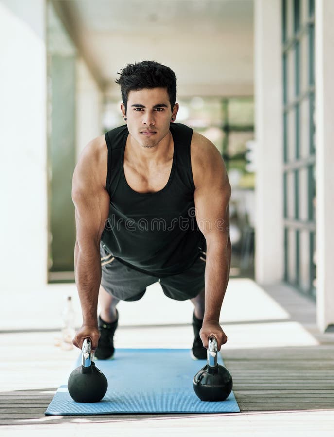 Wake Up, Work Out. Portrait of a Young Man Doing Pushups with Dumbbells ...