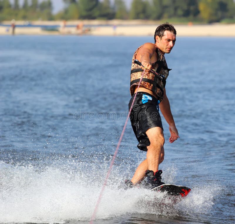 Wakeboarder in sunset. stock photo. Image of wakeboarder - 51696900