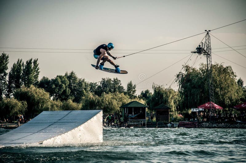 Wakeboarding at cable park editorial image. Image of kicker - 121428290