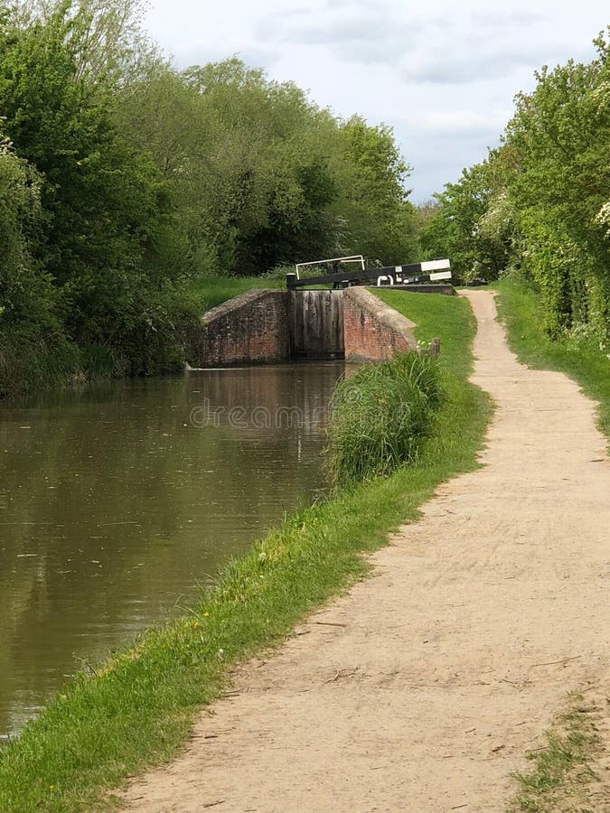A Walk Along the Canal Towpath Stock Photo - Image of walk, gates ...