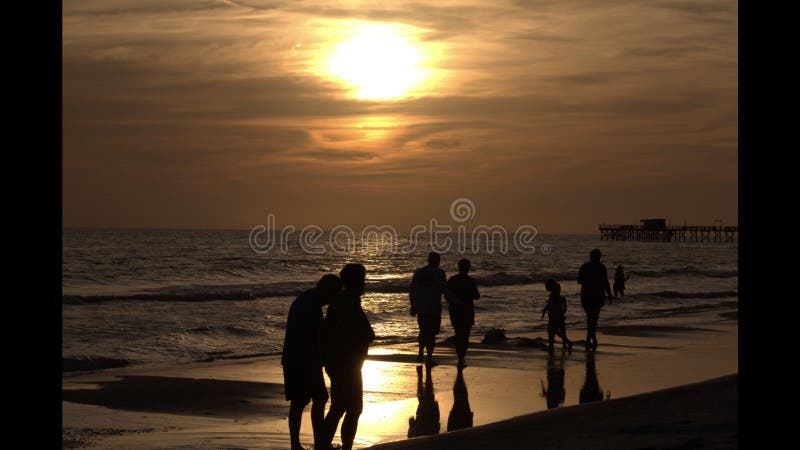 A Walk on the Beach at Sunset Stock Photo - Image of siloutte, coast ...