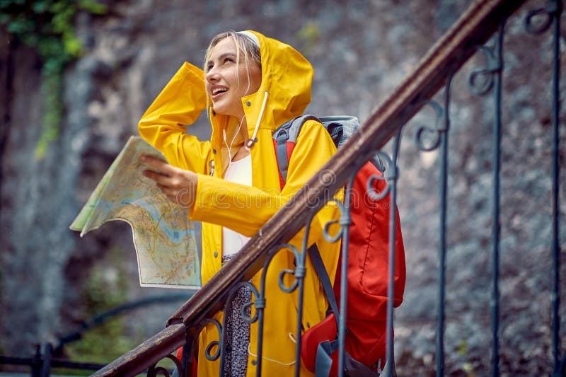 Walk In City In Rain Young Blonde With Map And In Raincoat Enjoying View Summertime Rain