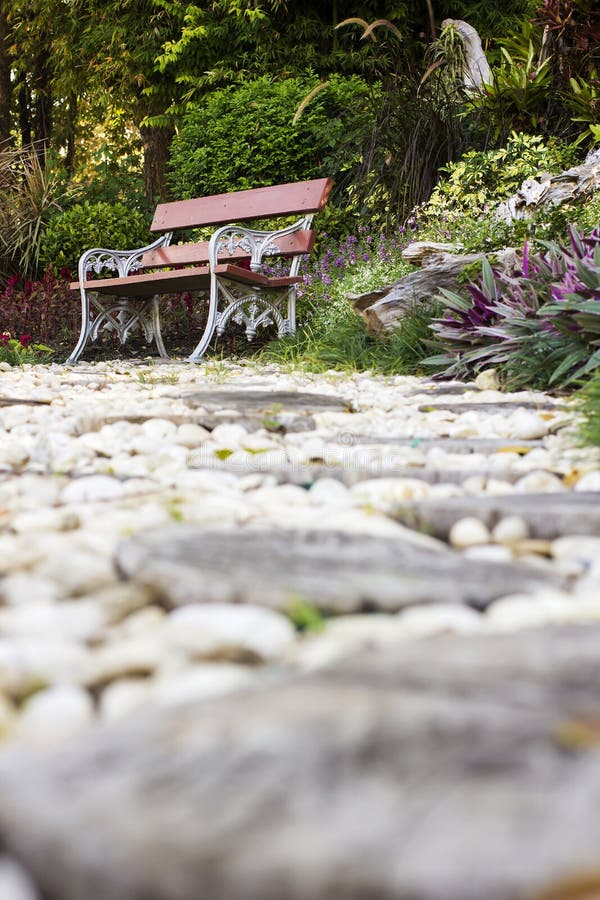 Walk Path in Garden To Art Bench Decorated with Stumps and Stone Stock ...