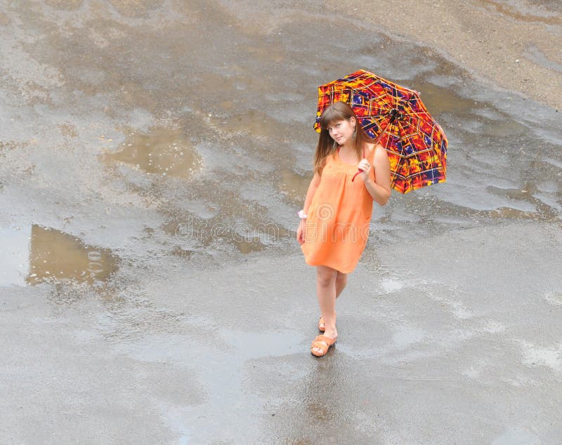 Walk in the rain stock image. Image of rain, warm, girl - 15383795