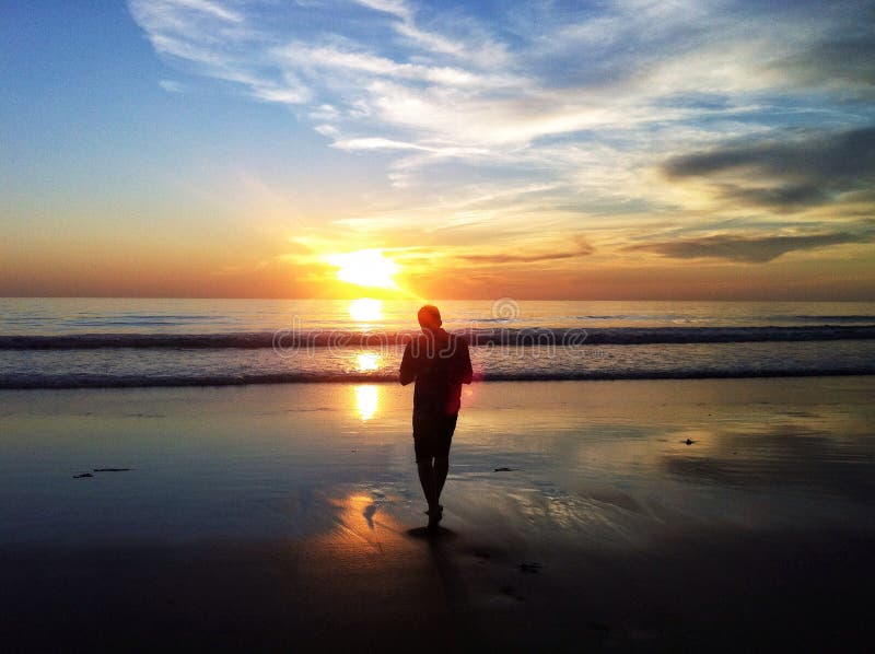 Walk into the sunset stock image. Image of east, beach - 42840201