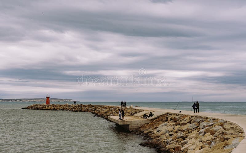 Walk To the Lighthouse on the Breakwater Stock Photo - Image of relax ...