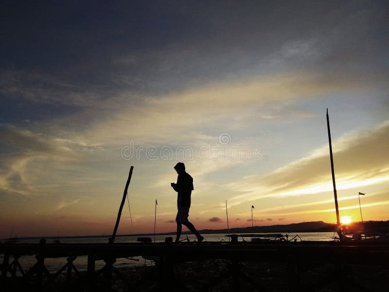 Walk under light of sunset editorial photography. Image of preset ...