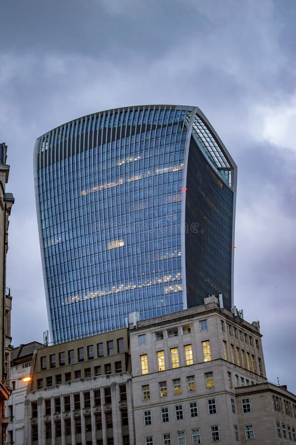 The Walkie Talkie Building with Cloudy Sky and Dark Lights Stock Photo ...