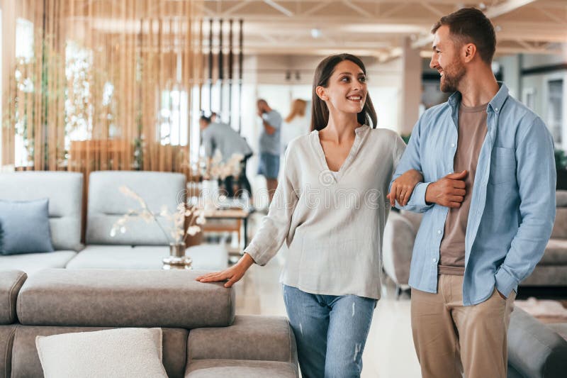 Walking Around. Couple Choosing the Sofa and Bed in the Store Stock ...