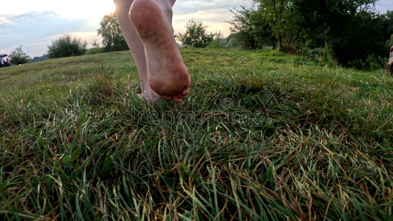 Walking Barefoot by Wet Grass Stock Footage - Video of chilling, drops: 303244690