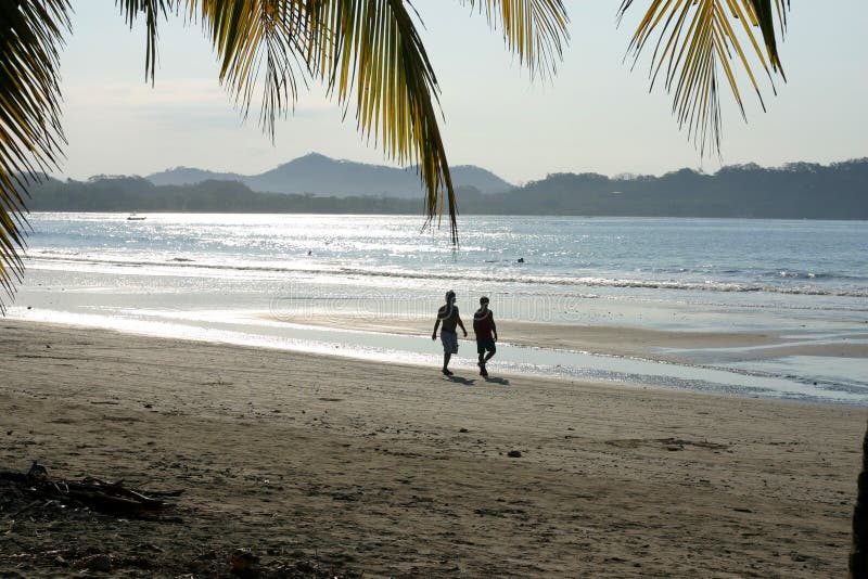 Walking on sea beach stock photo. Image of beach, shine - 107501642