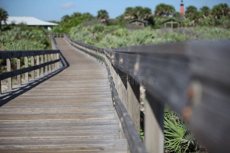 Walking on boardwalk stock photo. Image of sidewalk - 277338186