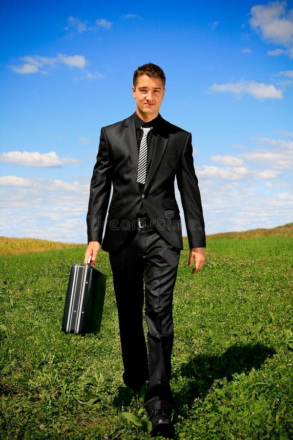 Walking businessman stock photo. Image of confidence, elegance - 6521440