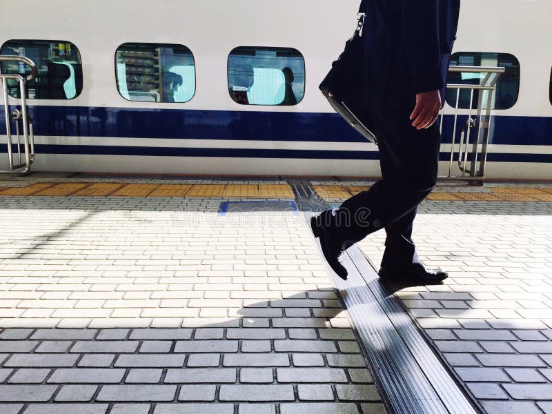 A Man Walking on the Train Station Background Stock Photo - Image of ...