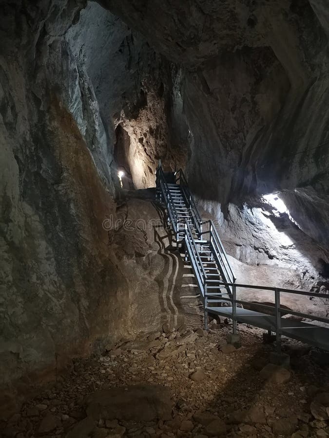 Walking in the cave stock photo. Image of geology, card - 231085096