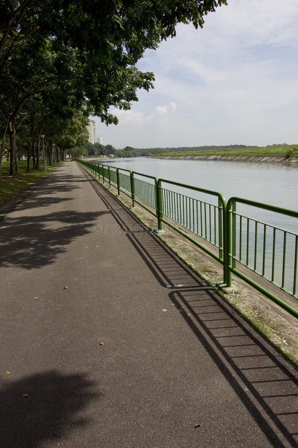 Walkway and Bridge Over a River Stock Photo - Image of cycling ...