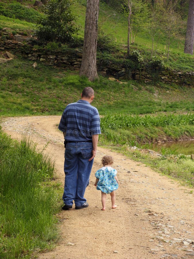 Walking on a dirt road stock photo. Image of happy, parent - 120360