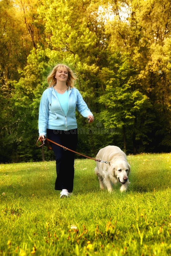 Walking with dog stock image. Image of sport, woman, animal - 6390277