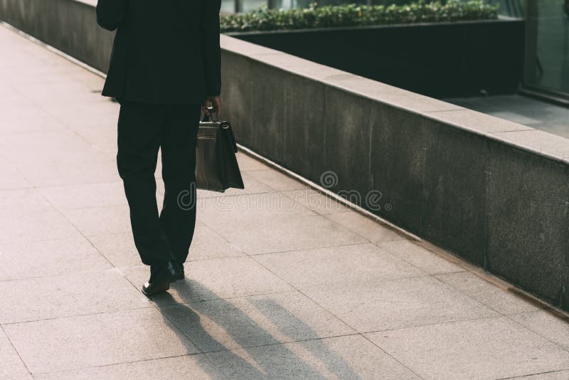 Walking down the street stock photo. Image of street - 50161216