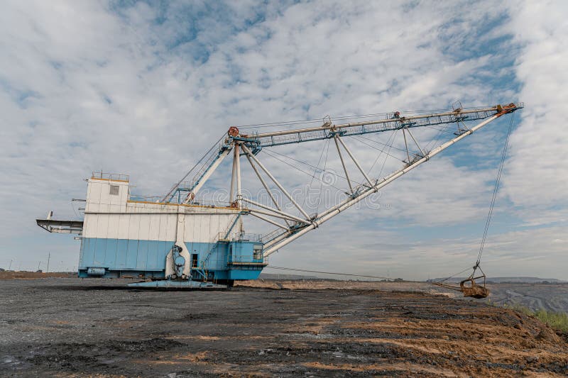 Walking Excavator Pours Chalk from Bucket Against Blue Sky Stock Image ...