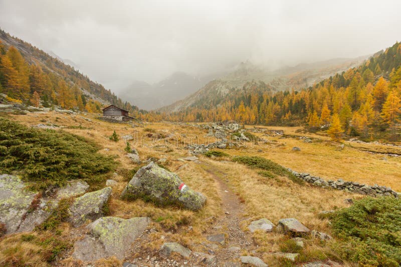 Walking at Fall in a Cloudy Day in a Mountain Valley Stock Photo ...