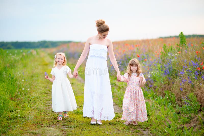 Walking Family through the Spring Field of Wild Flowers Stock Image ...