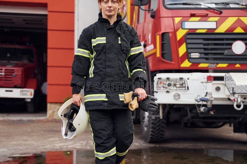 Walking Forward. Woman Firefighter in Uniform is at Work in Department ...