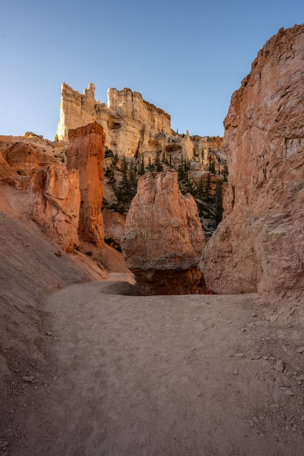 Walking between Hoodoos and Cliffs Below Bryce Point Stock Image ...