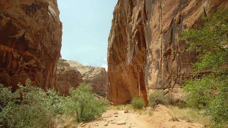 Walking between Huge Mountain Cliffs at Capitol Reef NP Stock Video ...
