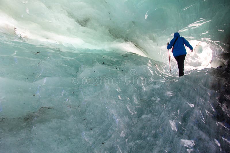 Walking through an Ice Cave with Blue Ice Stock Image - Image of franz ...