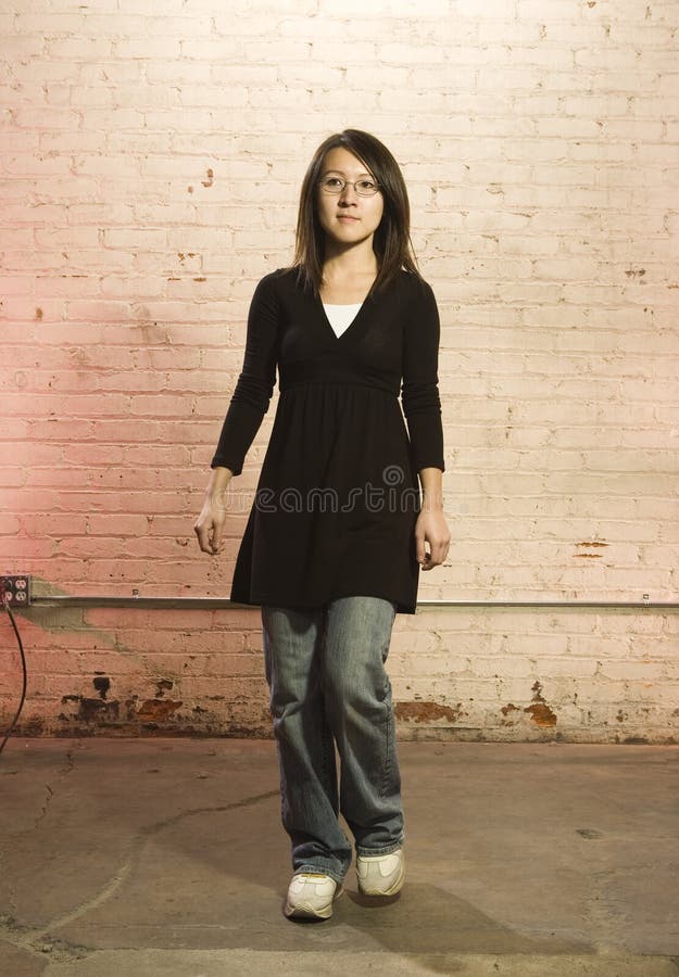Young Woman Walking through Maze with Cellphone Stock Photo - Image of ...