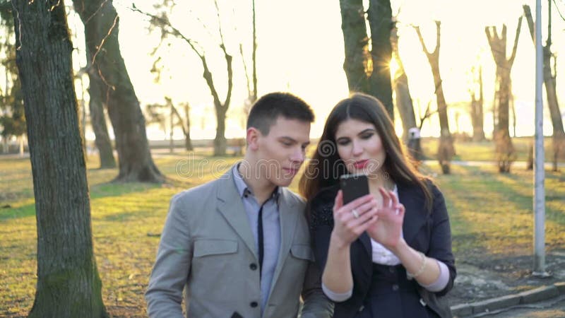Walking in the Park by Colleagues with Smartphone Stock Footage - Video ...