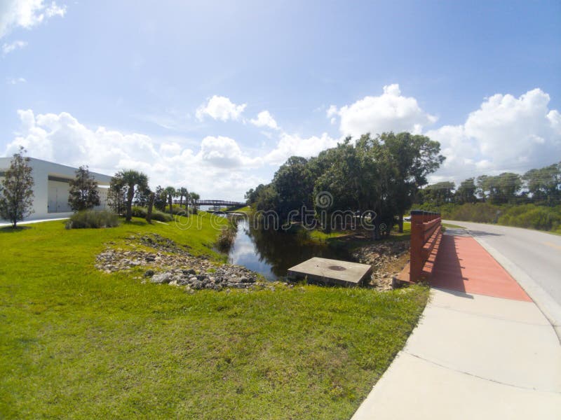 Walking Path Under a Bright Sunny Blue Sky with White Fluffy Clouds ...