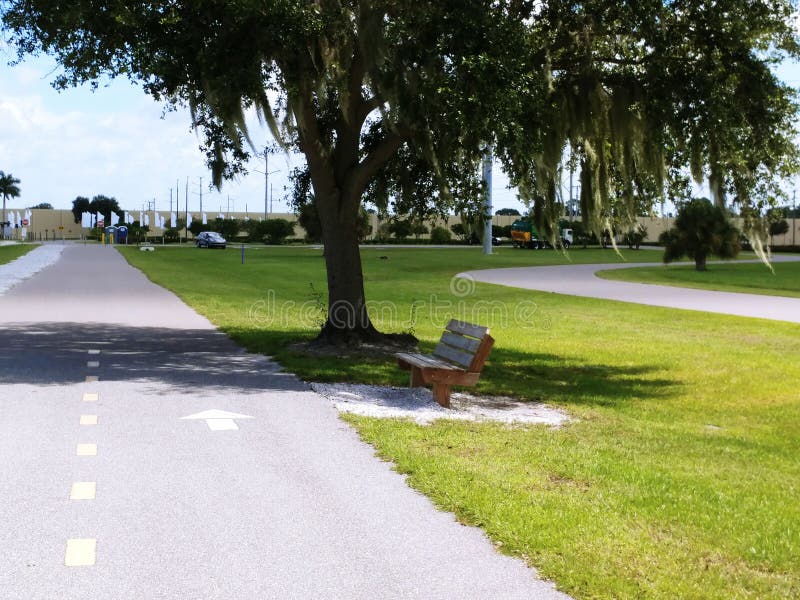 Walking Path Under a Bright Sunny Blue Sky with White Fluffy Clouds ...