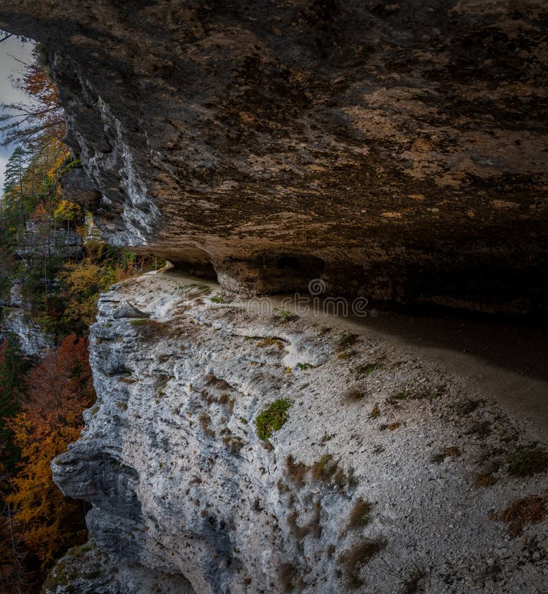 Walking Path Under a Rock Ledge in Alps Mountains Stock Image - Image ...