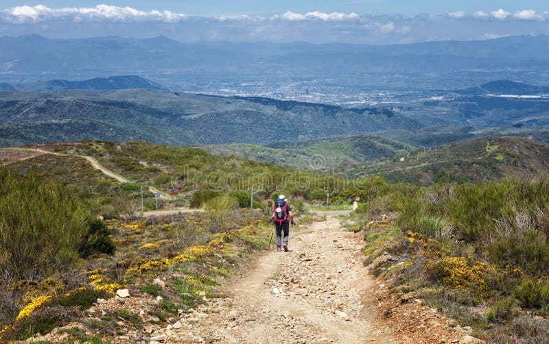 The Walking of a Pilgrim on a Hard Stage Passing the Iron Cross, Way of ...