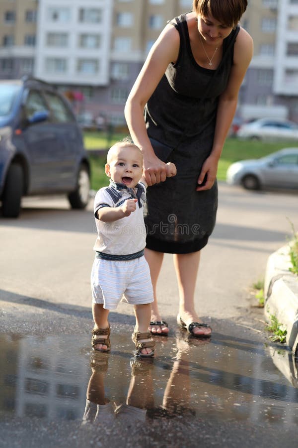 Walking through puddles stock photo. Image of cute, adult - 26430994