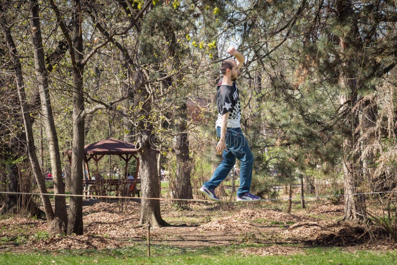 Walking on the rope editorial image. Image of skill, park - 95637780