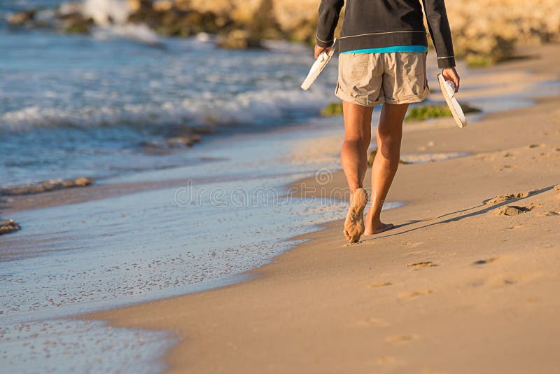 Walking on the sand stock photo. Image of people, leisure - 119921188