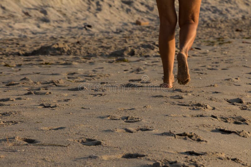 Walking on sand stock image. Image of back, sand, coastline - 73153185