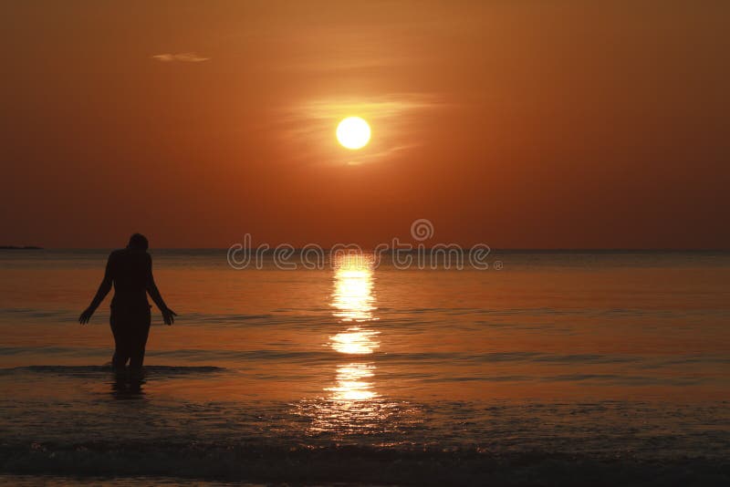 Walking into the Sea at Sunset Stock Photo - Image of nature, horizon ...