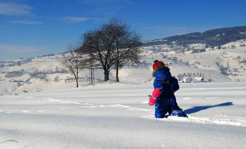 Walking through the snow stock image. Image of mountain - 80452941