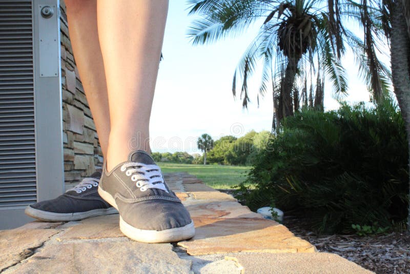 Walking on stone stock image. Image of trees, wall, shoes - 63806343